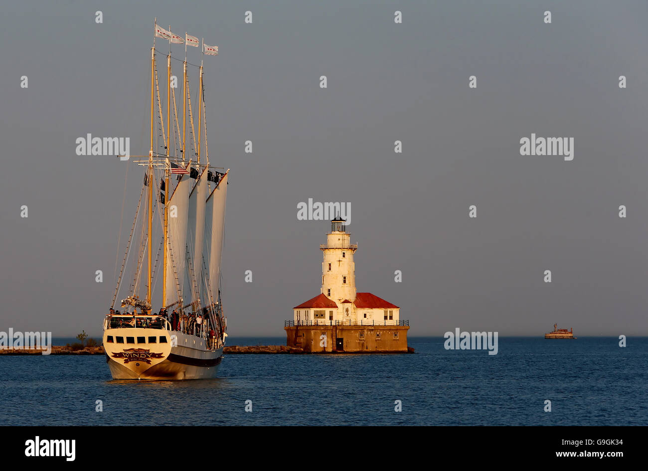 A view of the Chicago Harbor Light and the tall ship "Windy" as seen ...