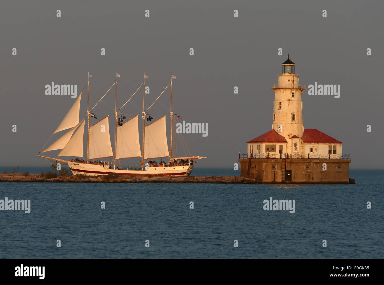 A view of the Chicago Harbor Light and the tall ship "Windy" as seen ...