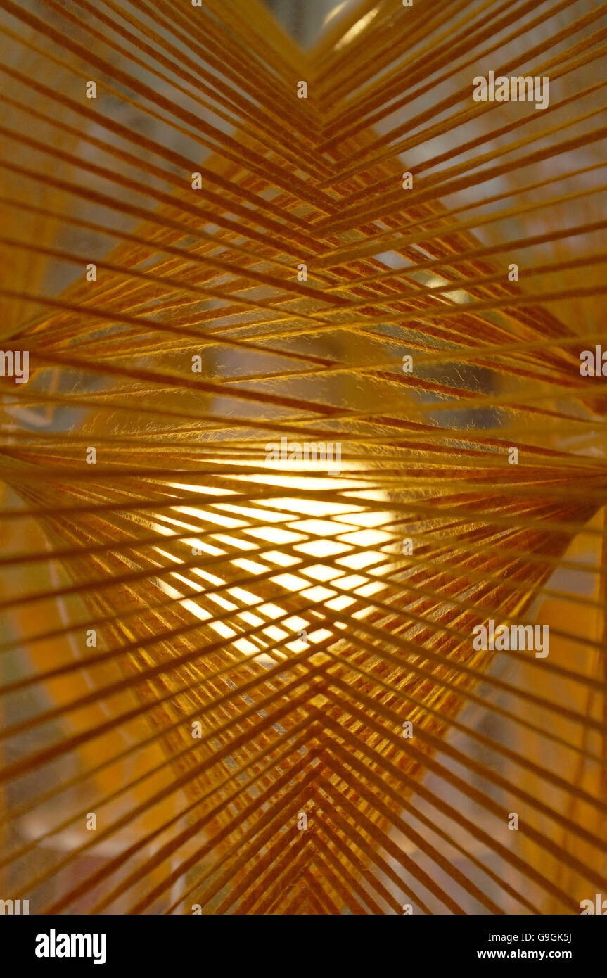 Abstract of various strings with yellow lighting Stock Photo - Alamy