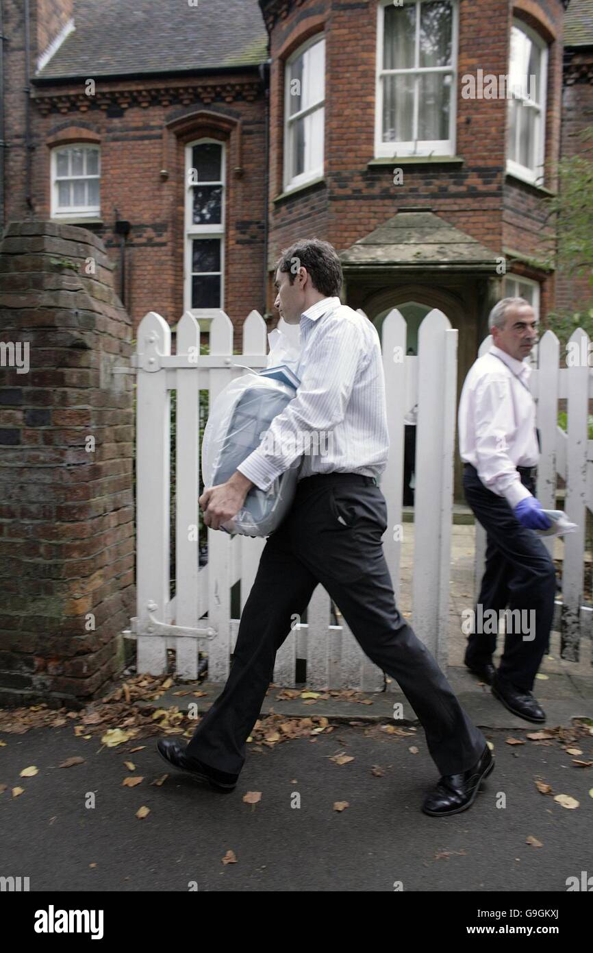 Police officers remove items from a property in Peterborough Road ...