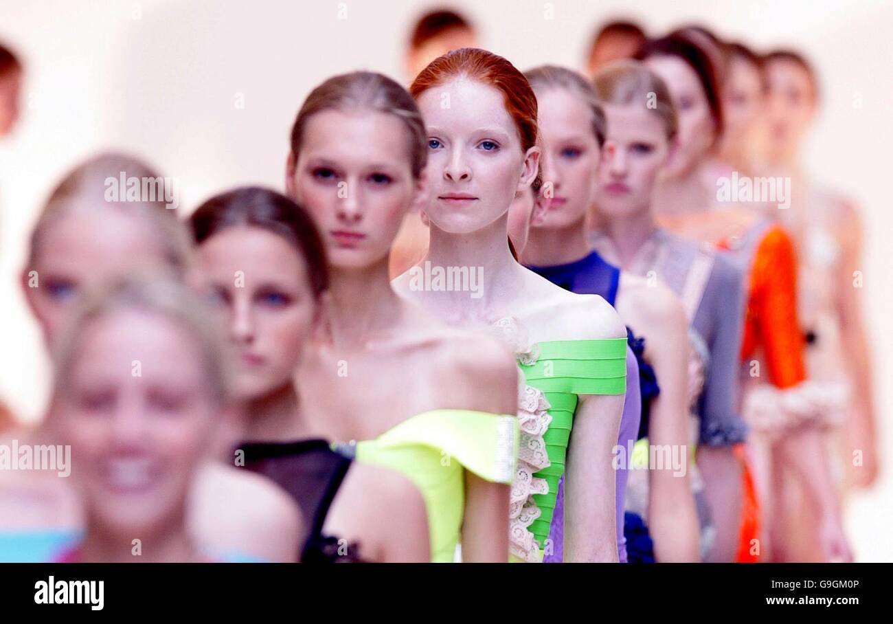 Models parade designs by Christopher Kane during London Fashion Week ...