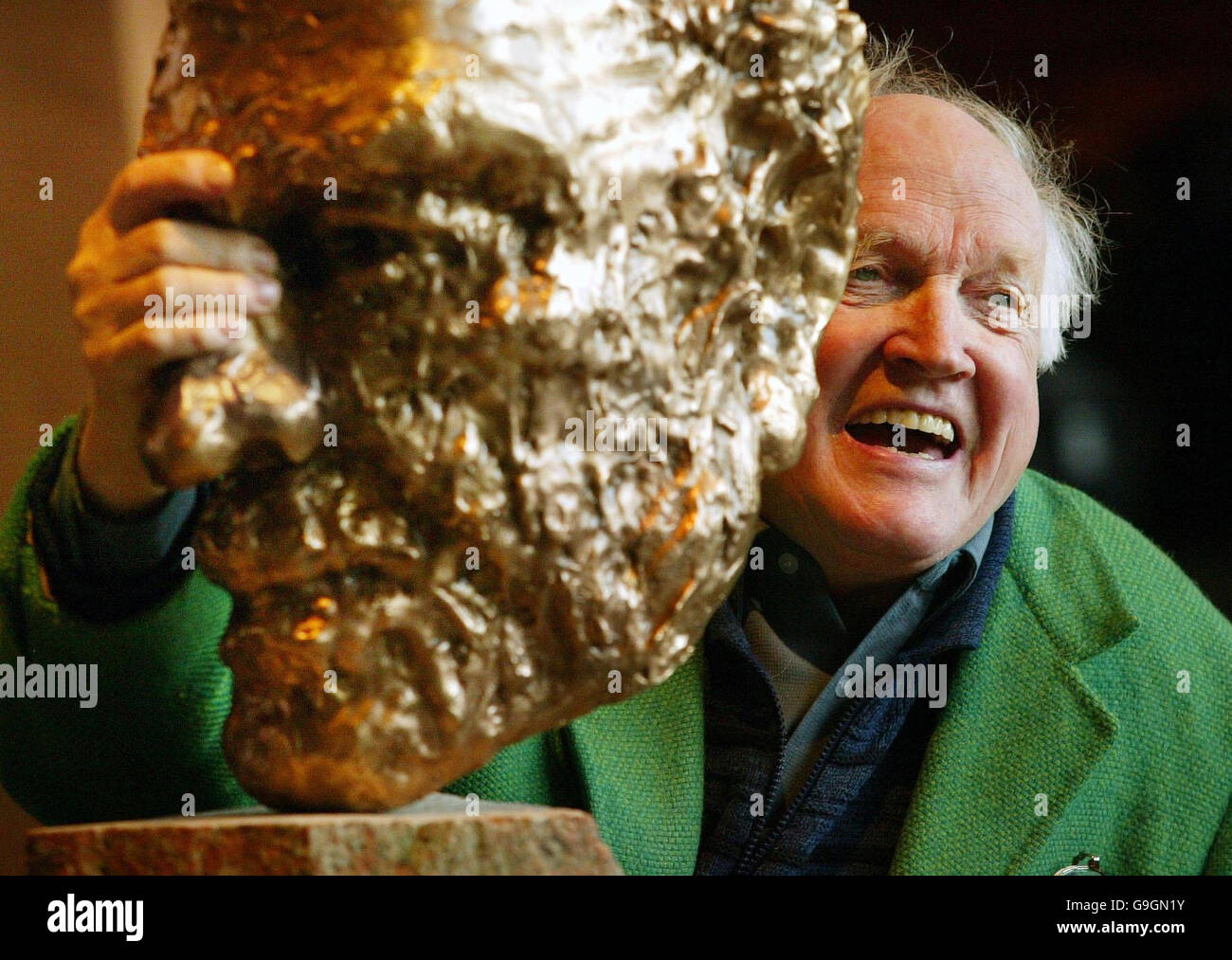 Artist George Wylie with one of his sculptures during a preview for a ...