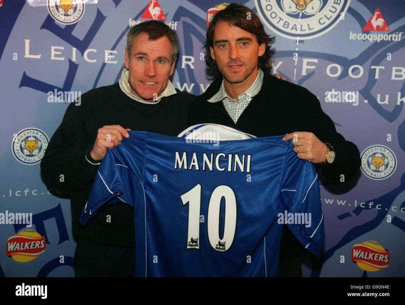 Leicester City's new signing Roberto Mancini holds his new shirt with ...