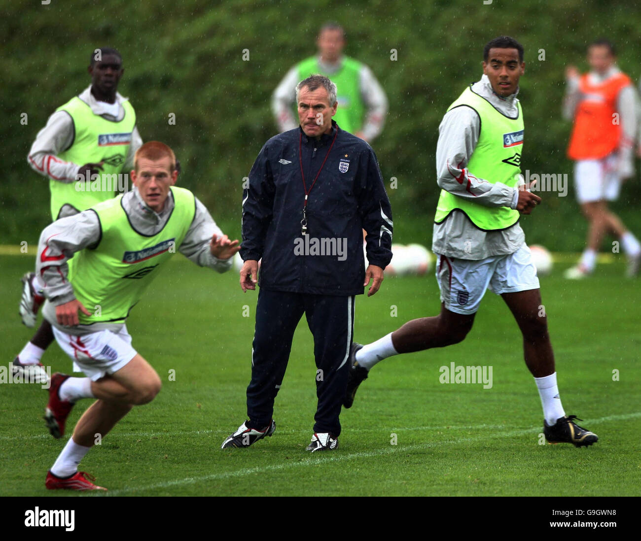 England U21 manager Peter Taylor watches Ben Watson (left) and Tom ...