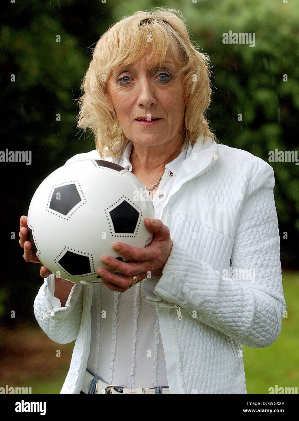 Angela Hickling, 56, holds a football in the garden of her home at ...