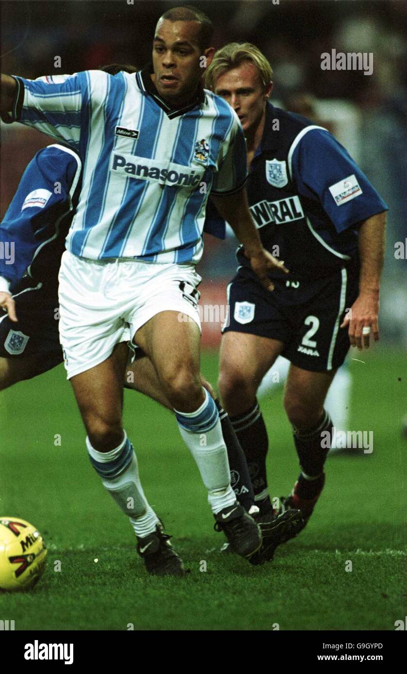 Huddersfield Town's Simon Baldry (l) tries to escape Tranmere Rovers ...