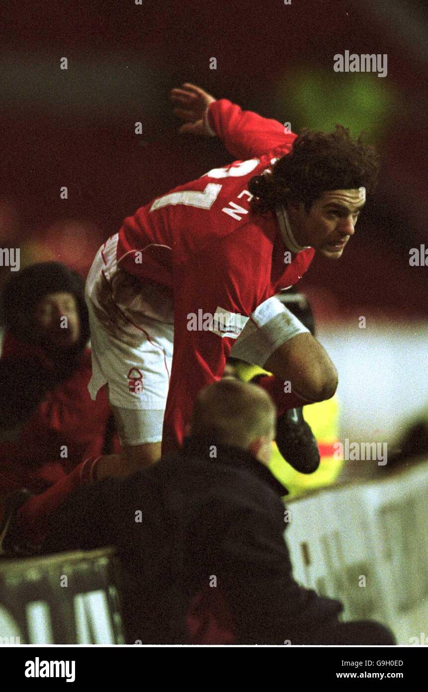 Nottingham Forest's Ben Olsen vaults over the perimeter boards to ...