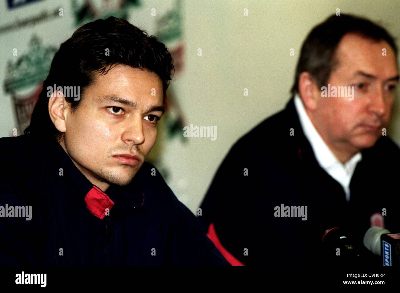 Liverpool's new signing Jari Litmanen (l) answers questions during a ...