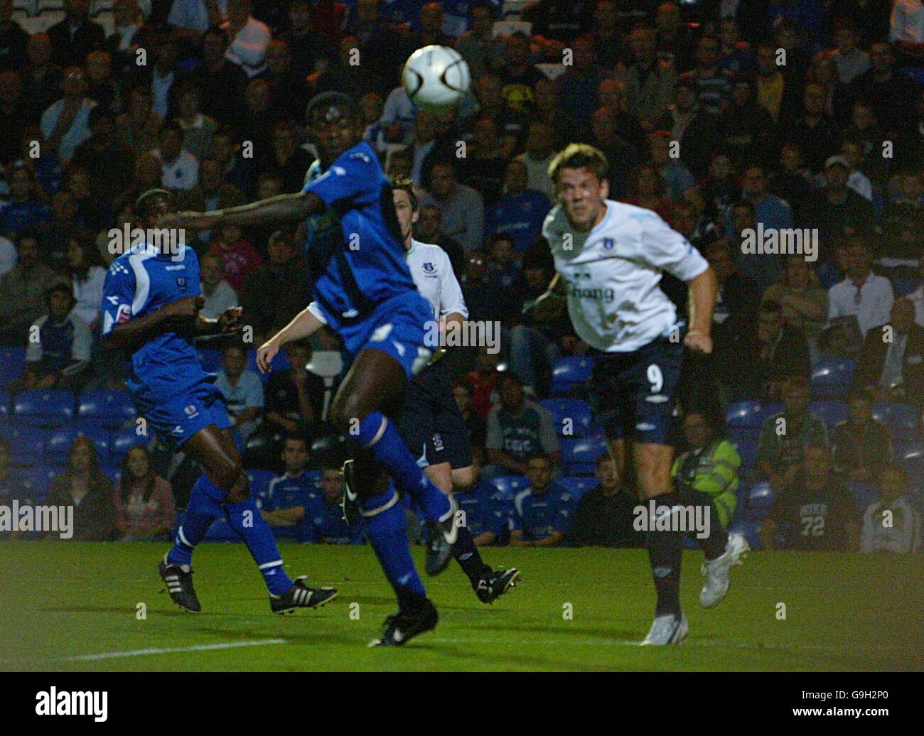 Everton's James Beattie heads in the first goal of the match after a ...