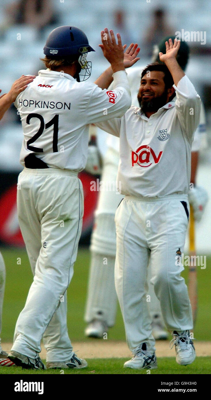 Sussex bowler Mushtaq Ahmed and Carl Hopkinson celebrate the wicket of ...