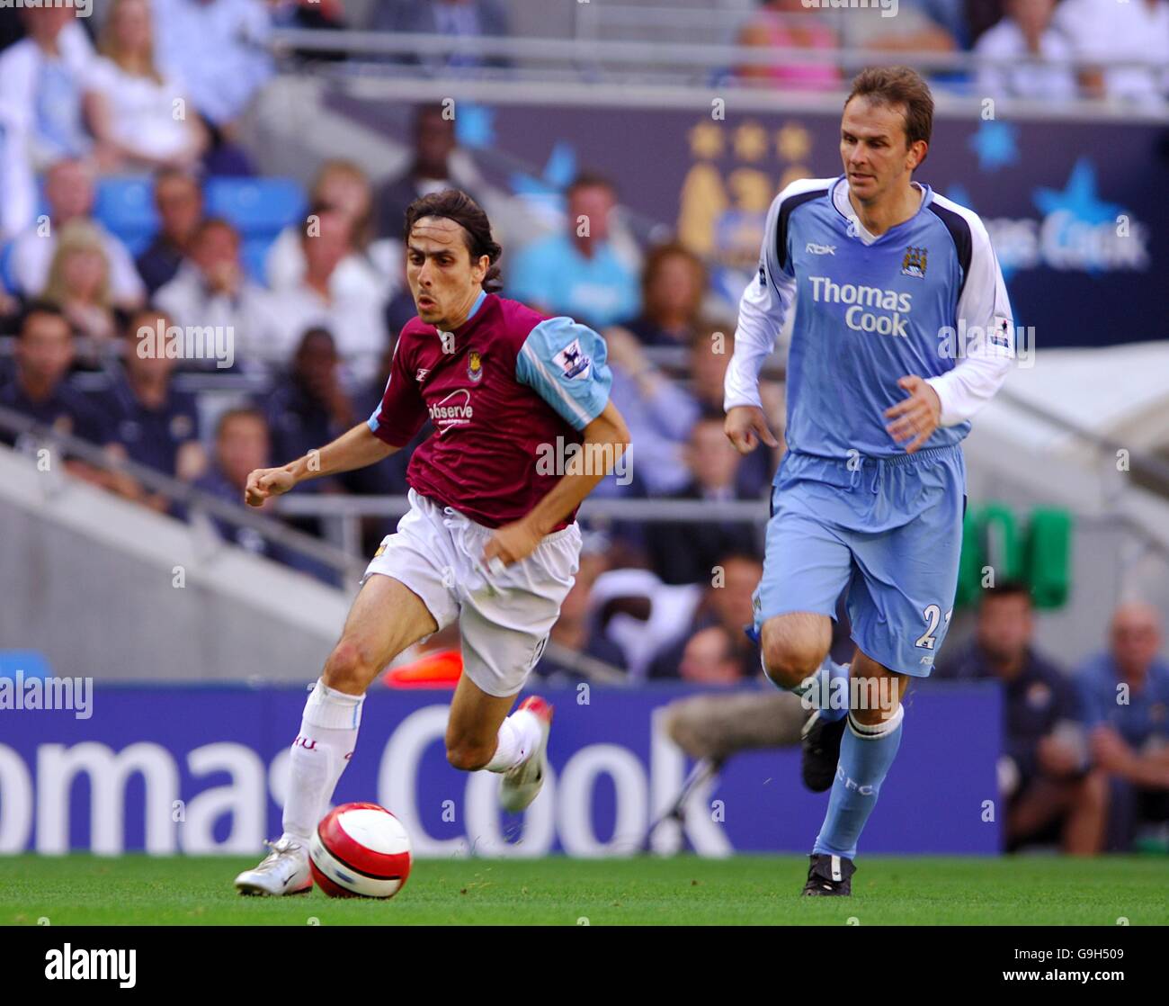 Yossi Benayoun of West Ham is chased by Manchester City's Dietmar ...