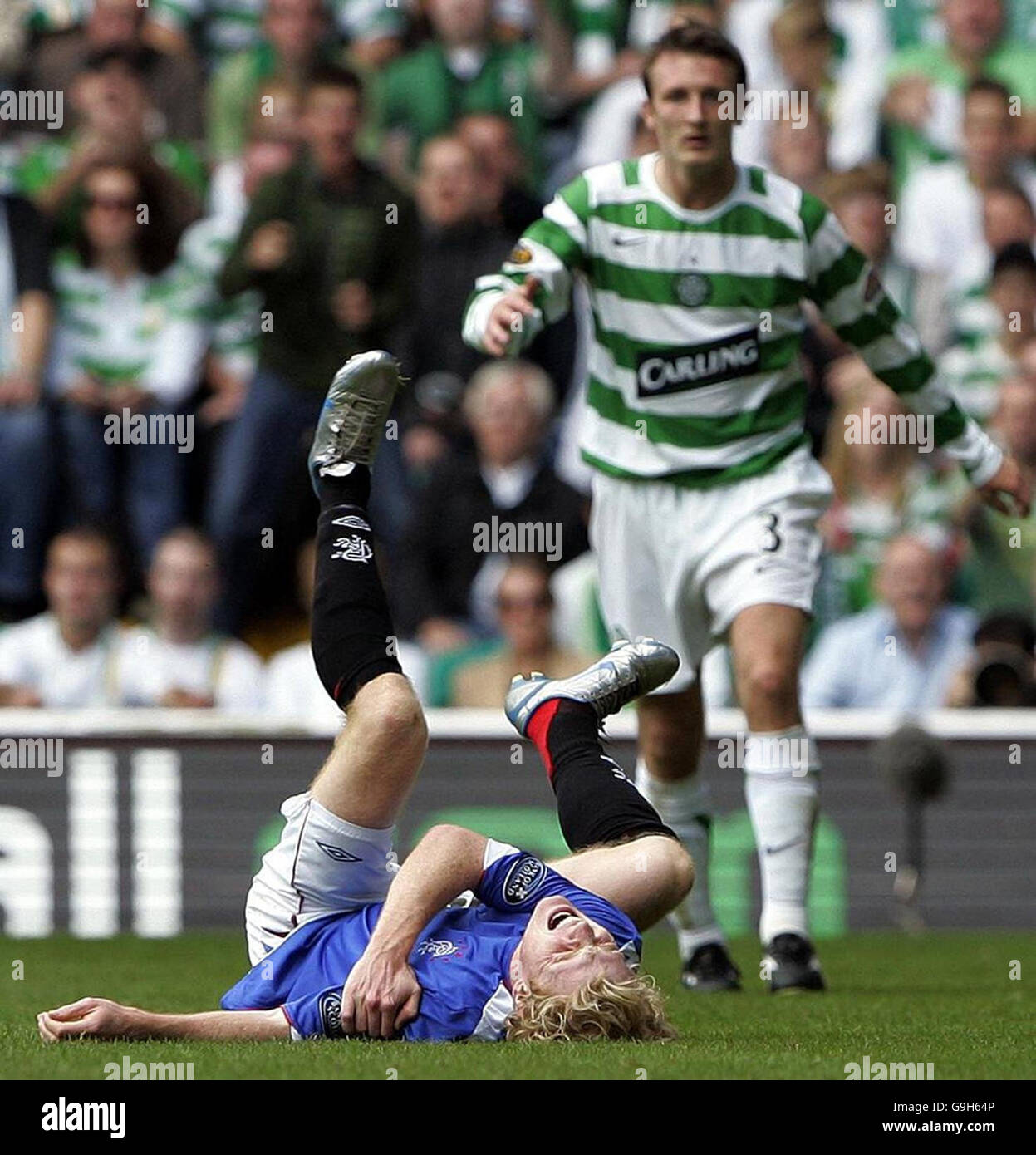 Rangers' Chris Burke injuring his shoulder against Celtic during the ...