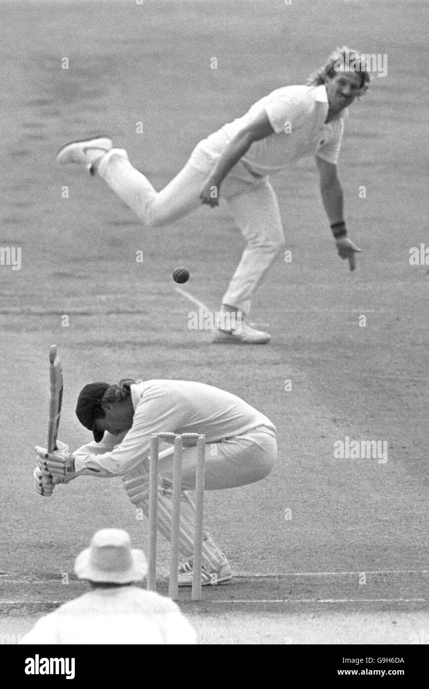 Australia's Wayne Phillips (bottom) ducks under a bouncer from England ...
