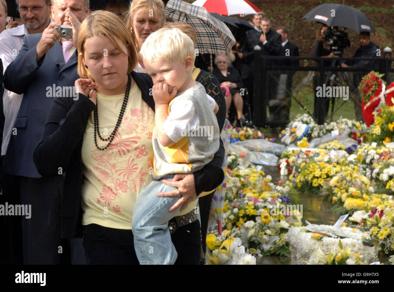 e of Peter Woodhams, and their son Sam at the funeral of Mr Woodhams ...