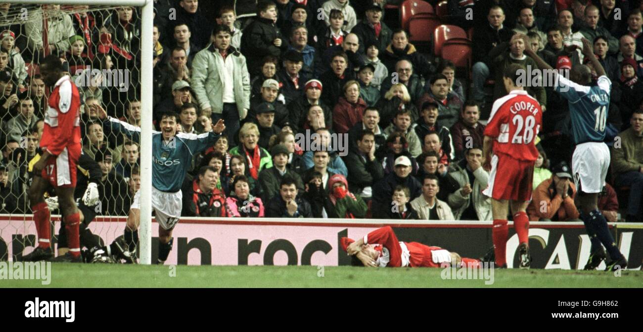 Manchester City's Andrei Kanchelskis celebrates the own goal scored by ...