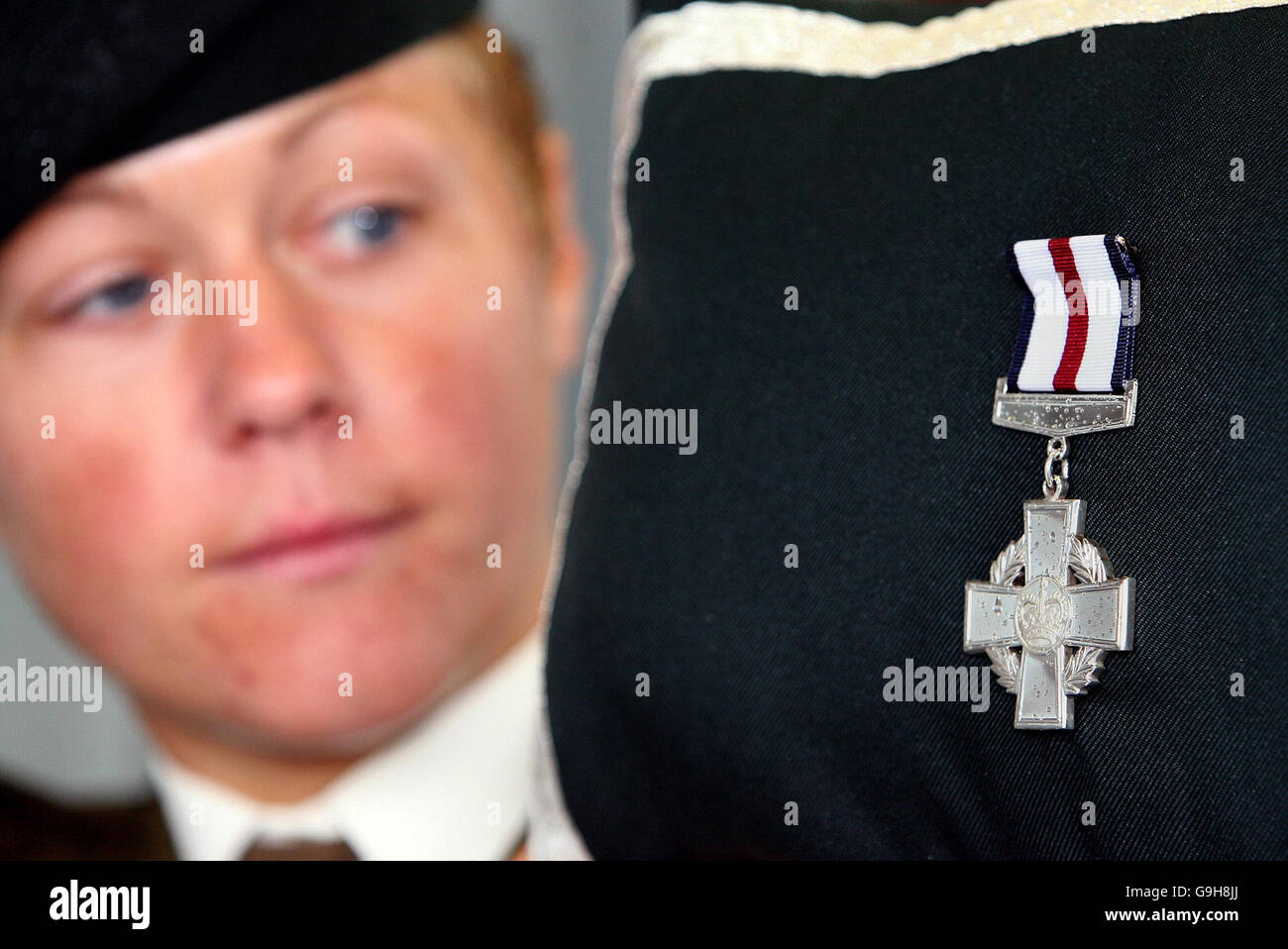 Britain's Queen awards the Conspicuous Gallantry Cross to the Royal ...