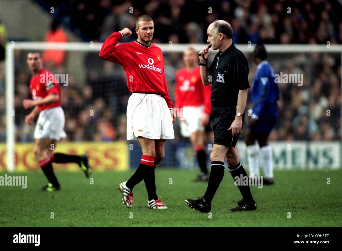 Referee David Elleray (r) blows his whistle to stop play as Manchester ...