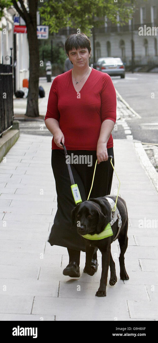Jane Vernan and her 6 year-old black labrador guide dog, Innis, in ...