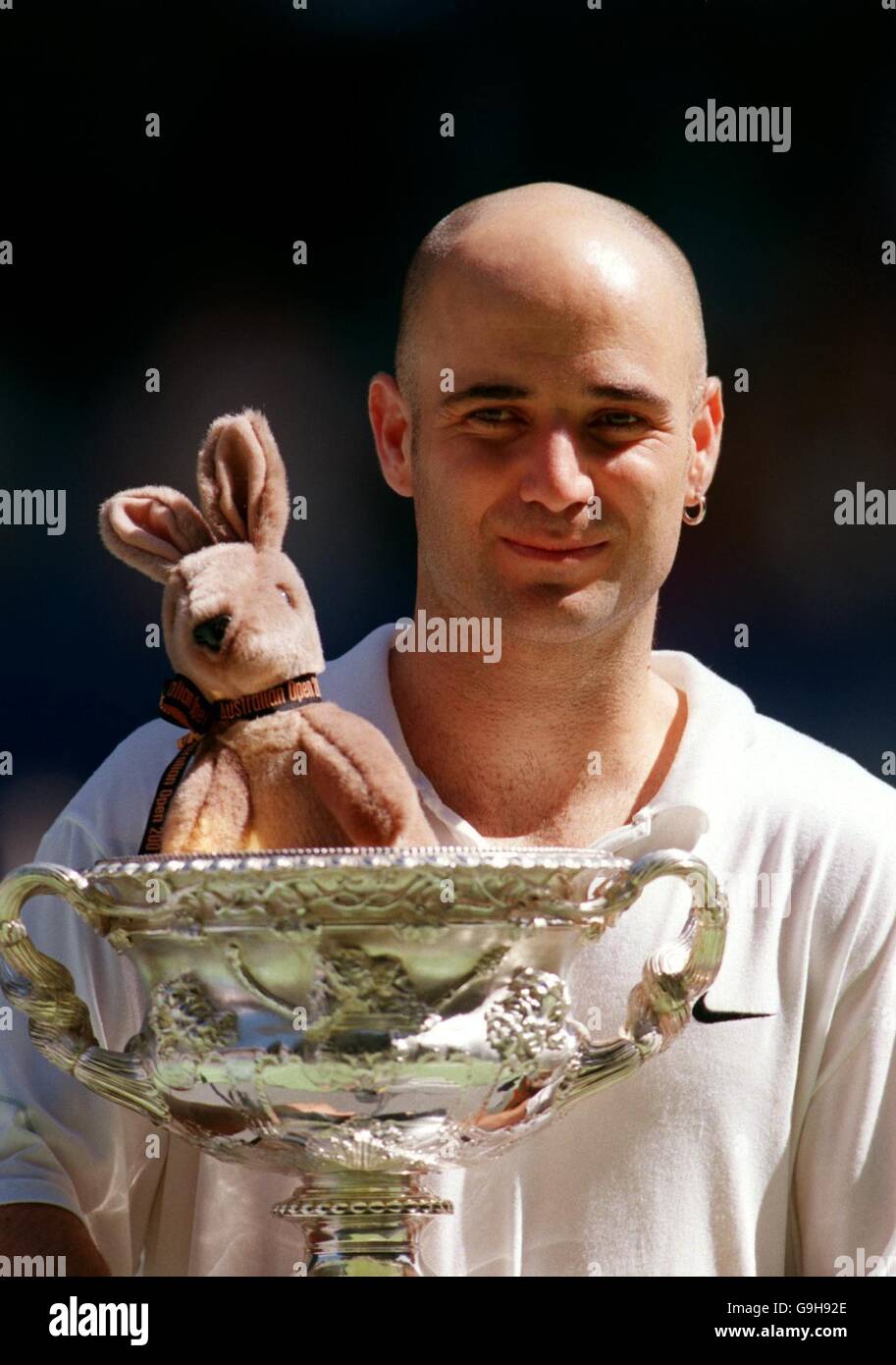 Andre agassi holds his australian open trophy hi-res stock photography ...