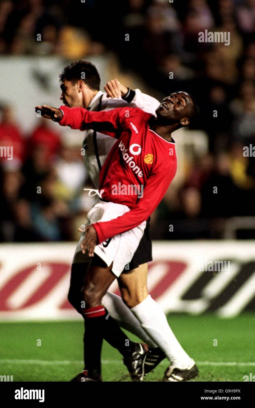 Manchester United's Andy Cole gets an elbow in the face from Valencia's ...