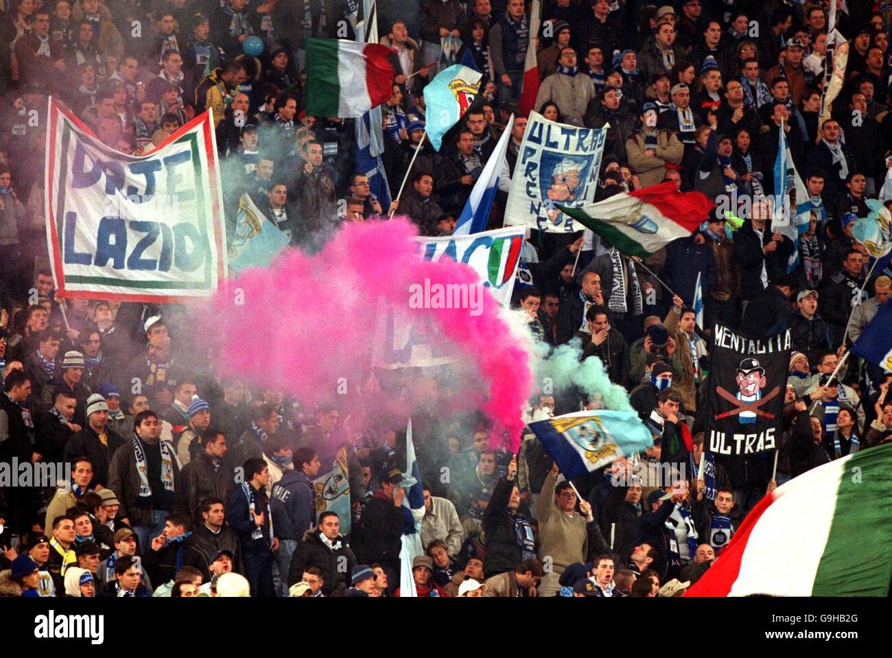 Roma fans light flares as they cheer on their team hi-res stock ...