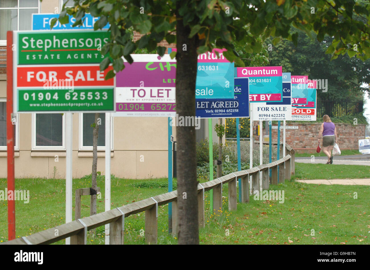 Rows of house sale and to let signs estate agent boards outside ...