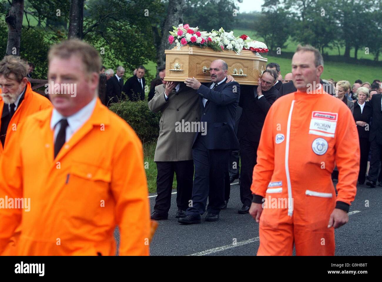 The coffin of top Irish Motorcycle road racer Darran Lindsay is carried ...
