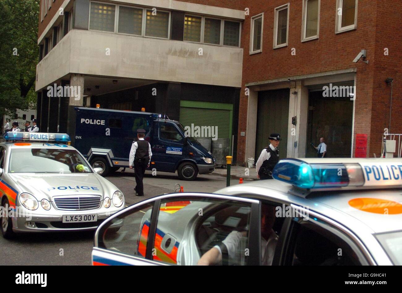 The first of two high security police vans carrying some of the six men ...