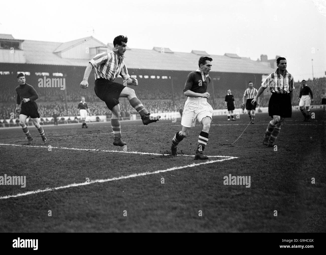 (L-R) Sunderland's George Aitken clears from Chelsea's Roy Bentley ...