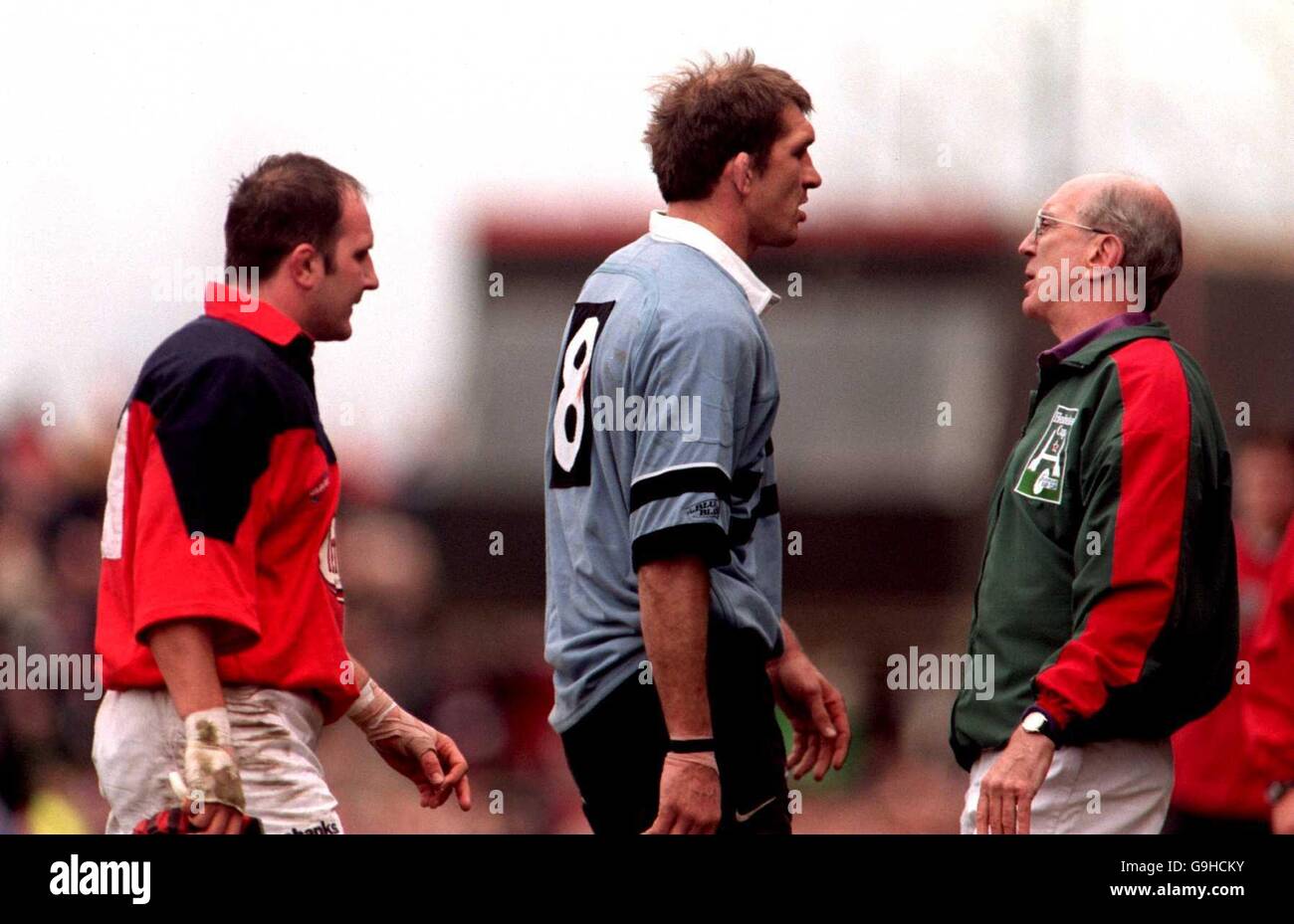 Llanelli's Ian Boobyer (l) and Cardiff's Emyr Lewis (c) walk towards ...