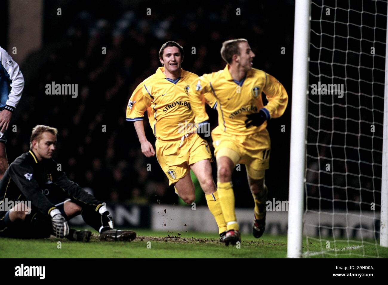 Manchester City goalkeeper Nick Weaver sits on the floor as Robbie ...