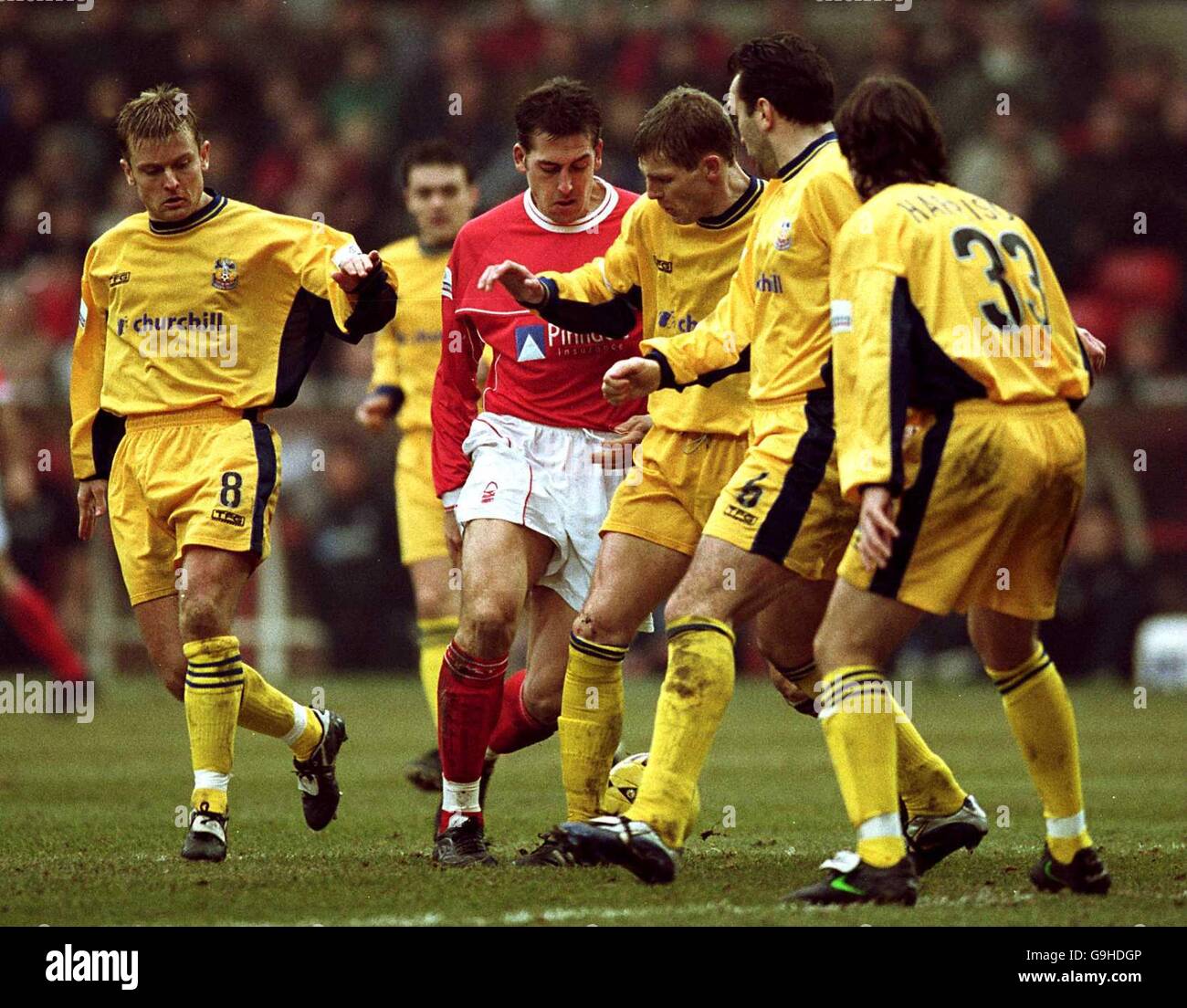 Nottingham Forest's Gary Jones is outnumbered by Crystal Palace's Simon ...