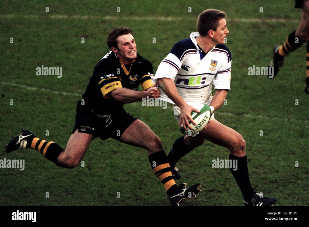 Wasps' Paul Sampson grabs Swansea's Shaun Payne before he releases the ...