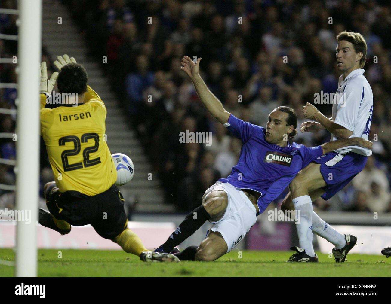 Rangers' Dado Prso (centre) challenges Molde's Jan Larsen during the ...