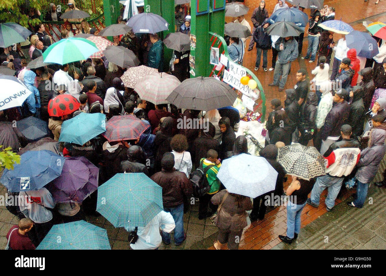 People observe a two-minute silence at the Bridgeway shopping parade in ...