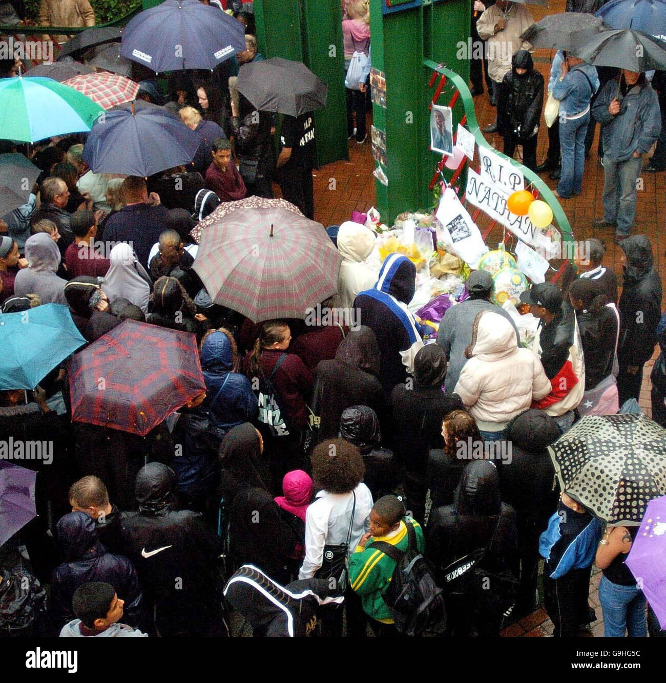 People observe a two-minute silence at the Bridgeway shopping parade in ...