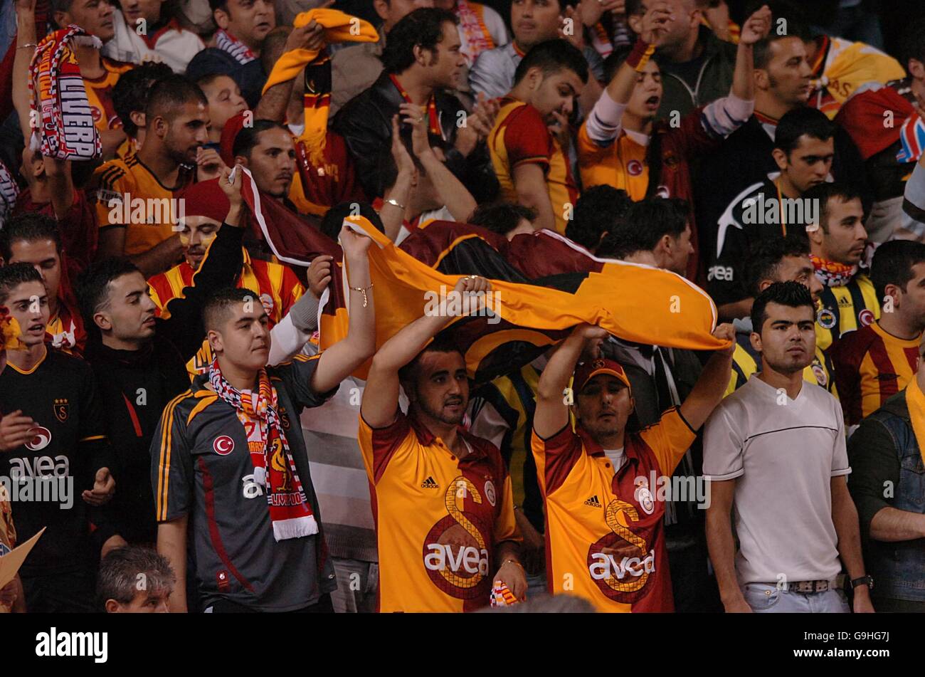 Galatasaray fans welcome their team onto the pitch hi-res stock ...