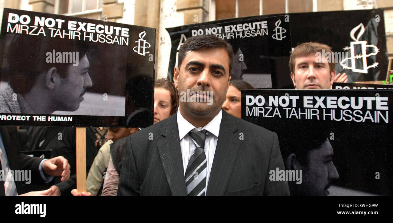 Mr Mirza Amjad Hussain stands outside the Oxford Union Building, where ...