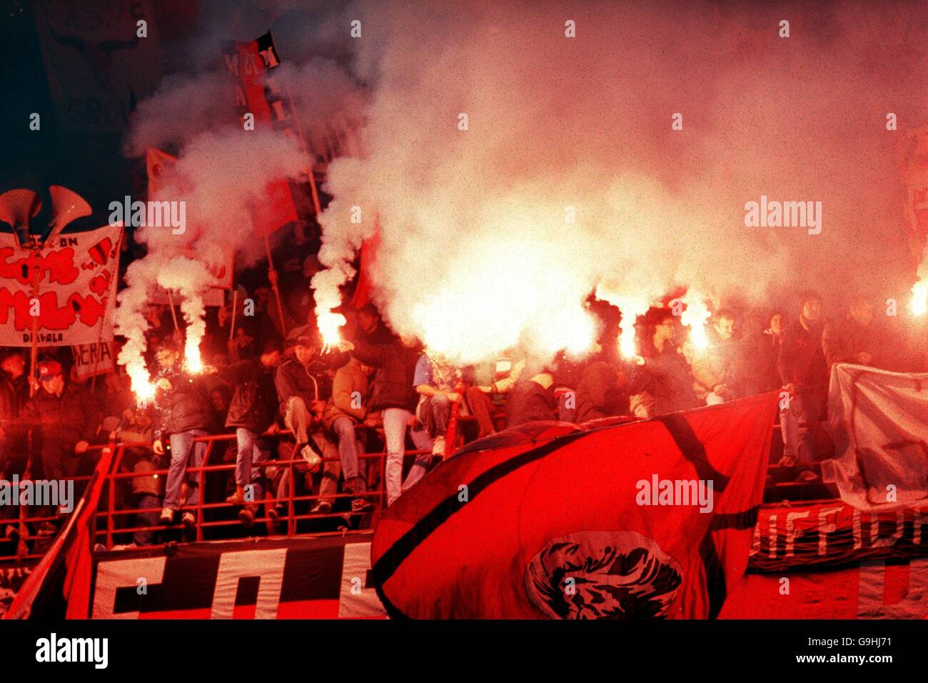 The ac milan fans light up the stands with flares hi-res stock ...