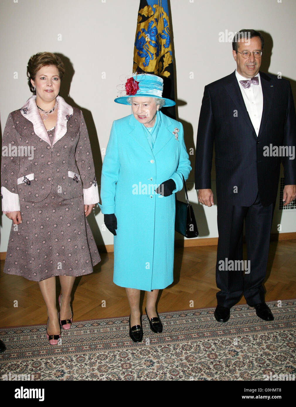 Britain's Queen Elizabeth II (centre) is greeted by President Thomas ...