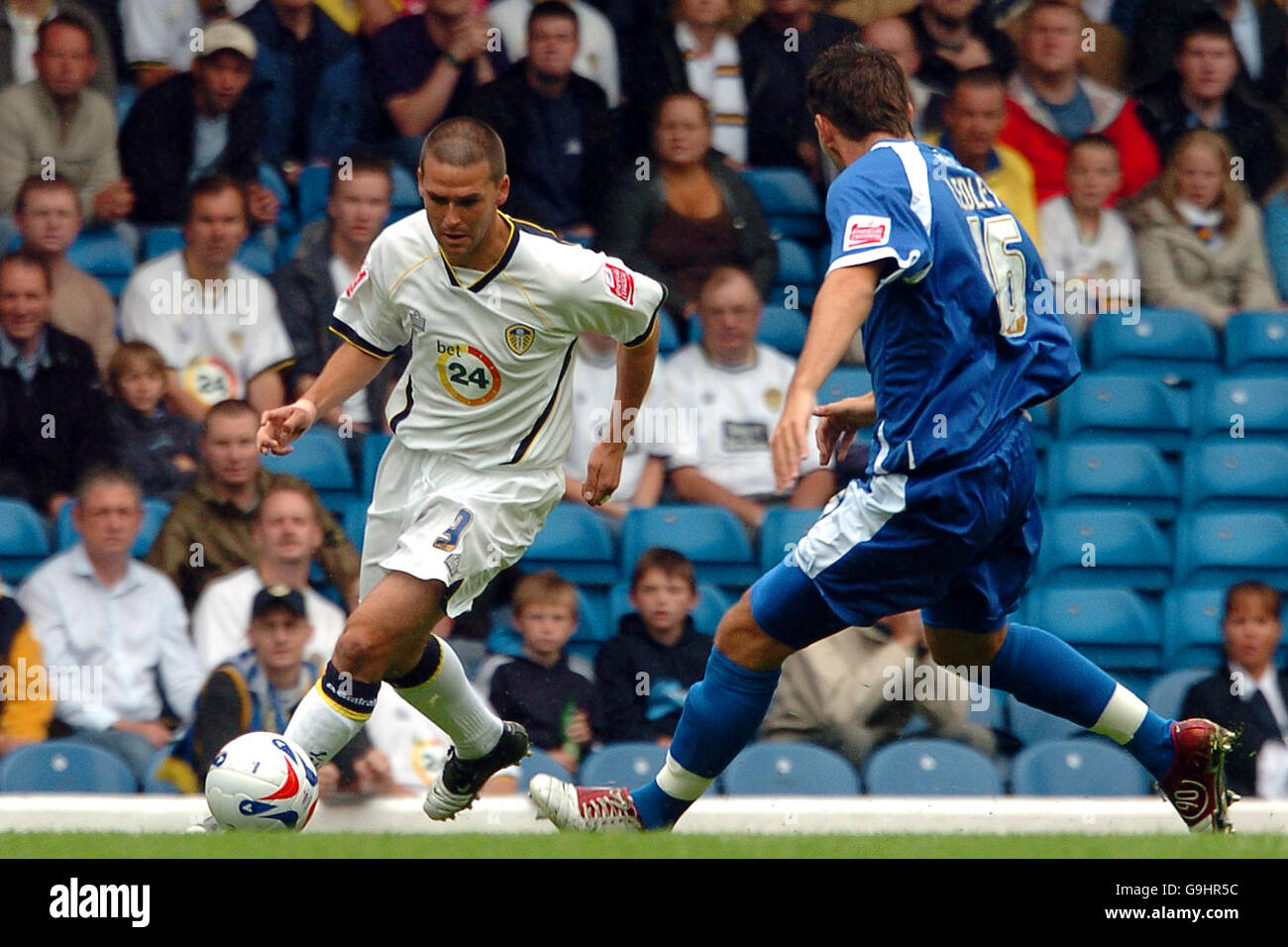 Cardiffs joe ledley follows leeds uniteds david healy hi-res stock ...