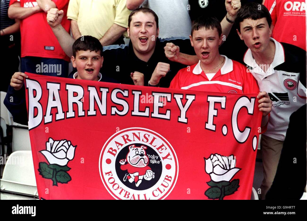 Barnsley fans proudly hold their teams flag hi-res stock photography ...