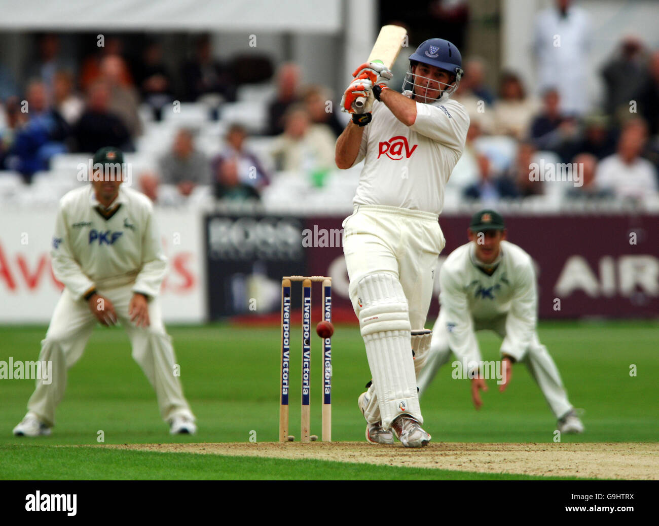 Sussexs michael yardy hits one straight down the pitch hi-res stock ...