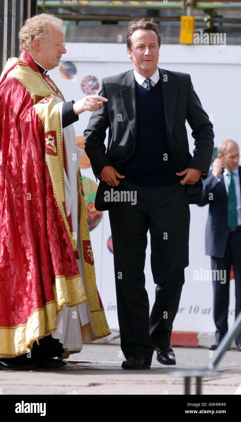 Tory party leader David Cameron is greeted by the Dean of Southwark the ...