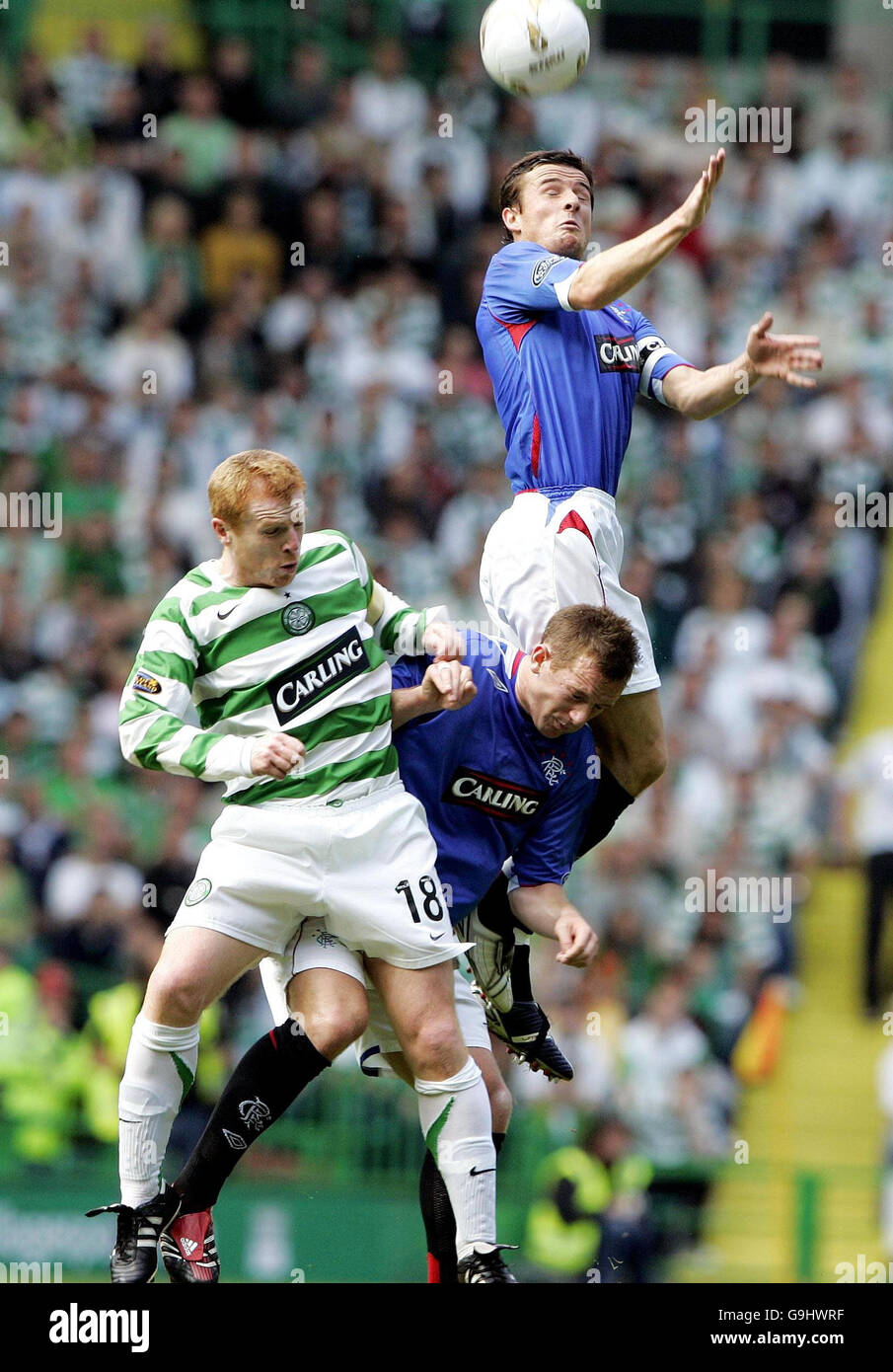 Celtic's Neil Lennon (left) challenges Rangers' Barry Ferguson during ...