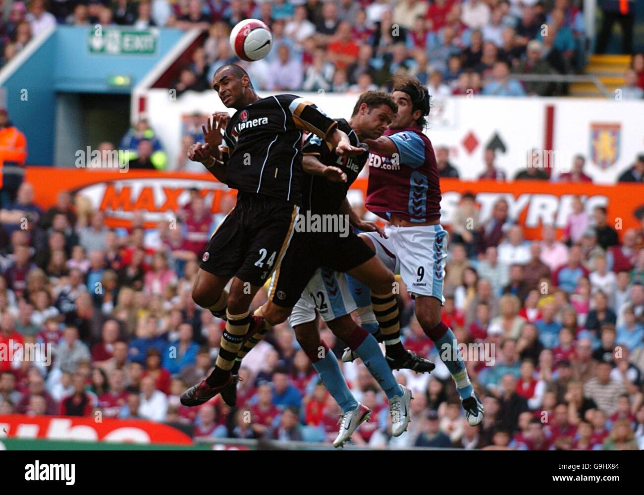 Charlton Athletic's Jonathan Fortune (l) wins a header from Aston Villa ...