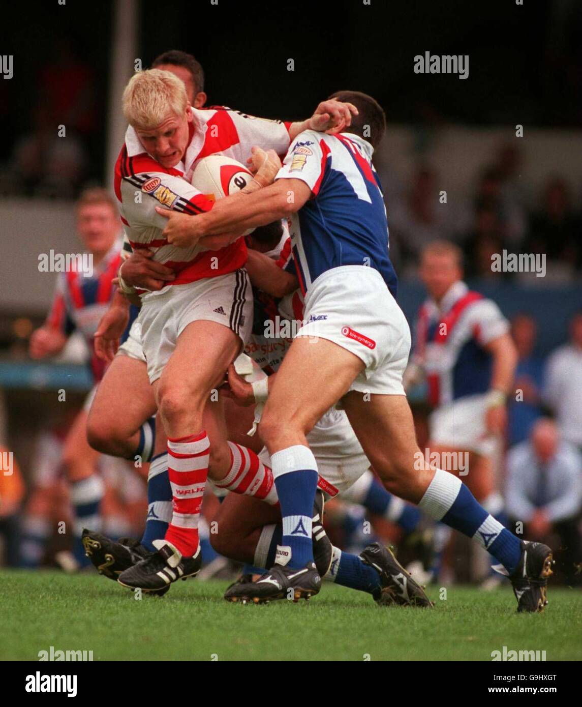 Wigan warriors mick cassidy tries to burst through a tackle hi-res ...