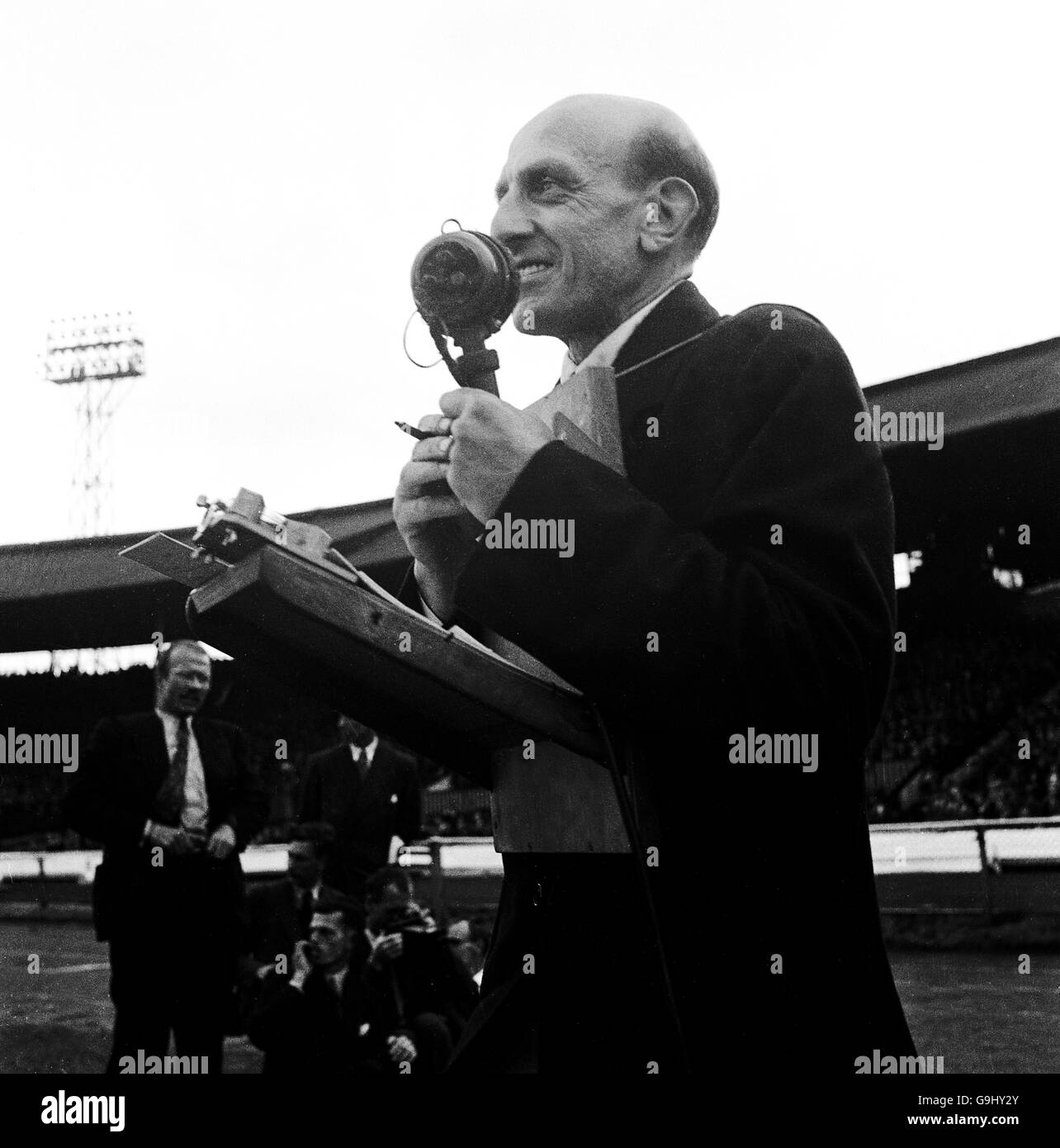 Former olympic 100m champion harold abrahams speaking into the ...