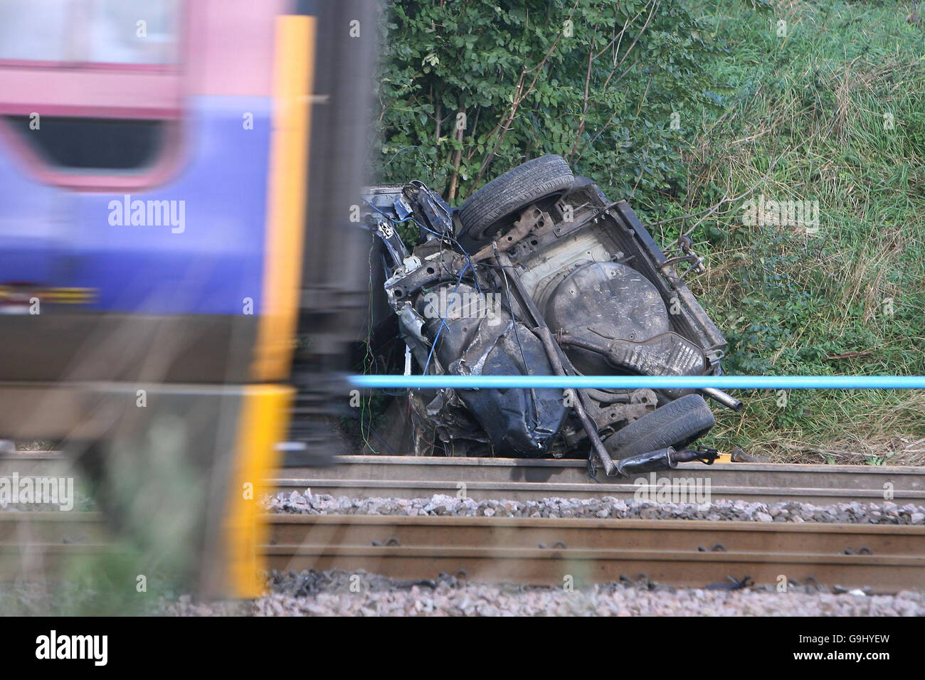 Motorist dies as train hit by car Stock Photo - Alamy