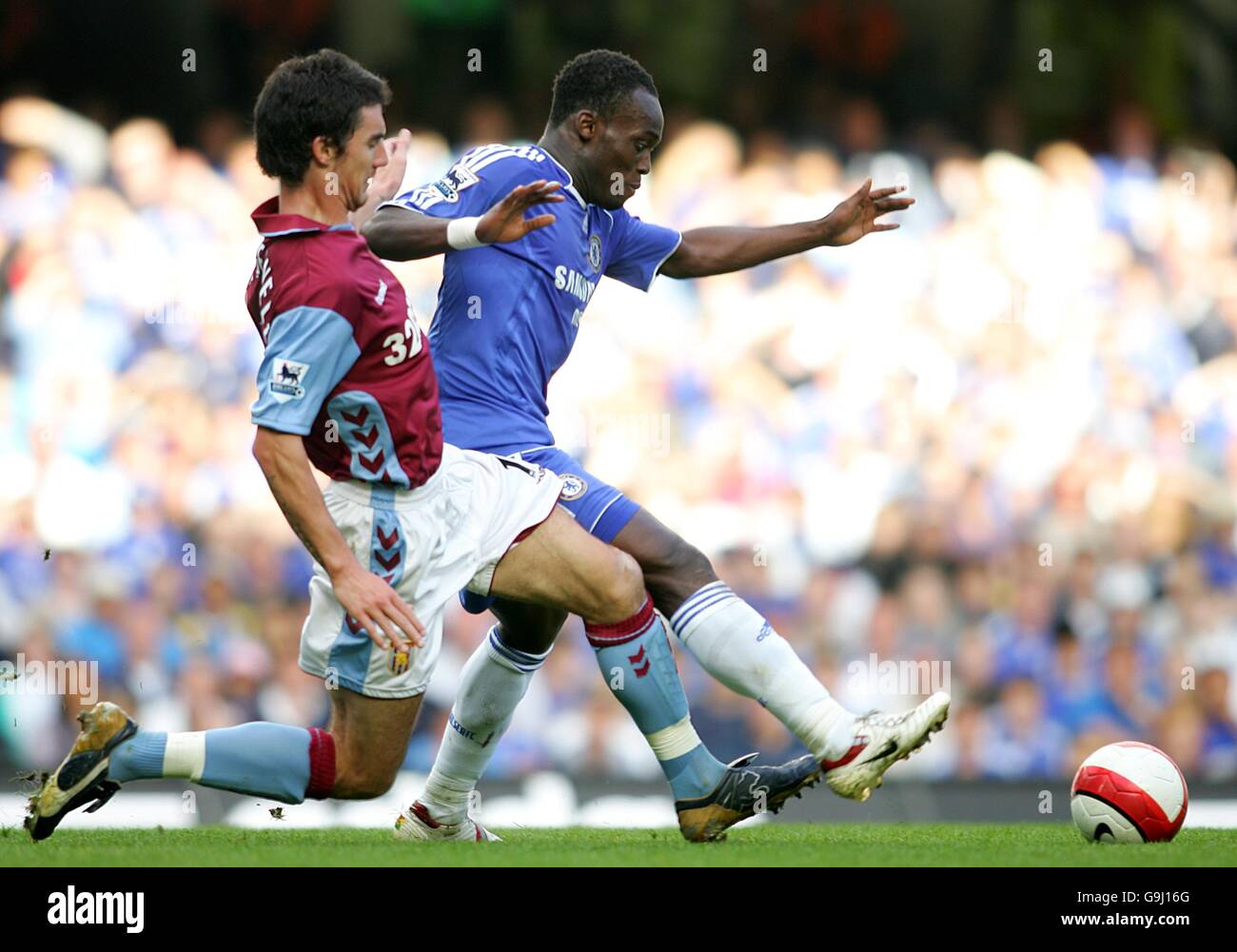 Chelsea's Michael Essien battles for the ball with Aston Villa's Liam ...